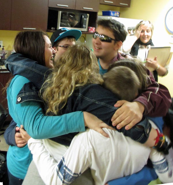 These 5 photos show the students greeting each other, sitting and ...
