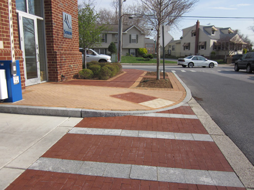 Garage entrance: Five photos show a brick driveway entering a parking ...