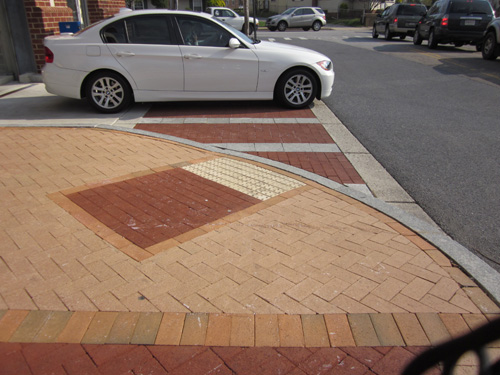 Garage entrance: Five photos show a brick driveway entering a parking ...