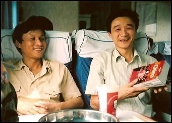 Song Ping Chen enjoyed reading my China tour book on the train.